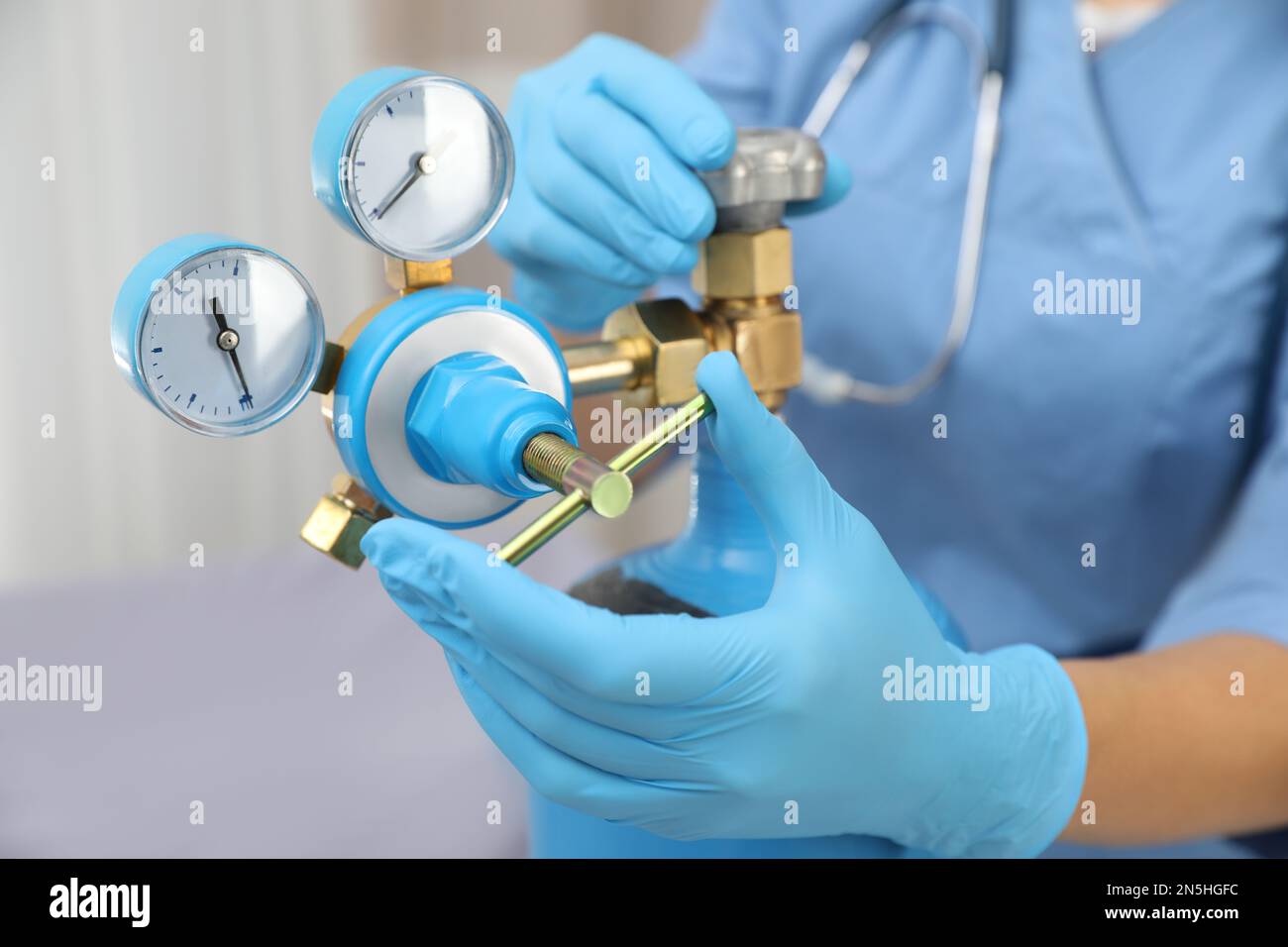 Medical worker checking oxygen tank in hospital room, closeup Stock ...