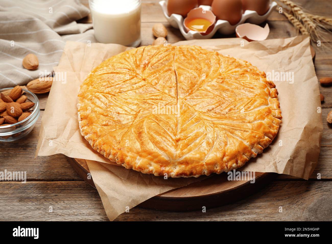 Traditional galette des rois on wooden table Stock Photo - Alamy
