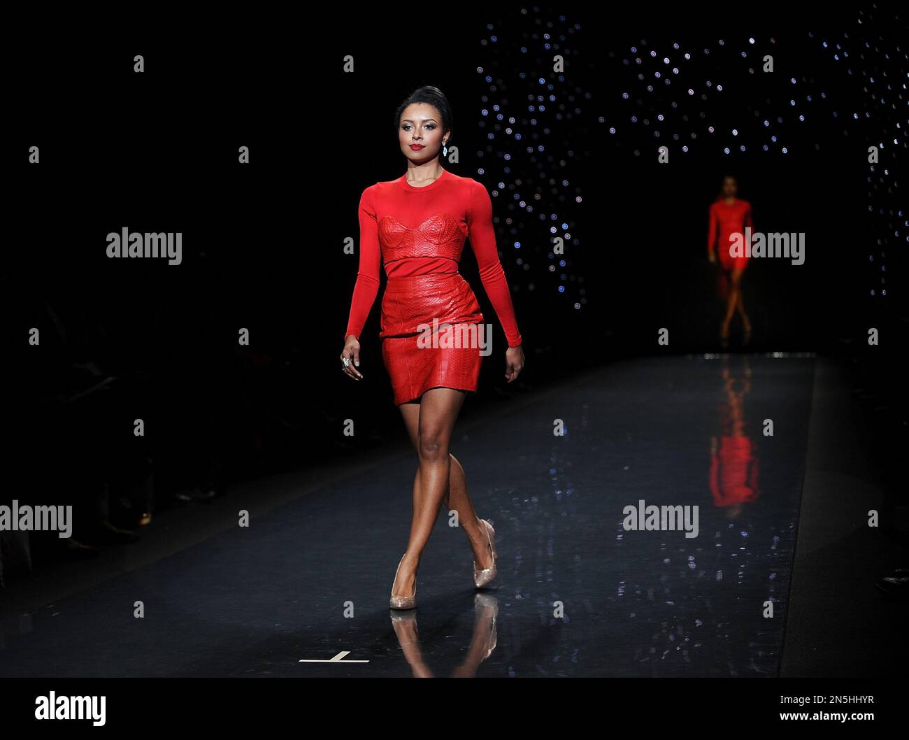 American actress Kat Graham models an outfit from the 2014 Red Dress ...