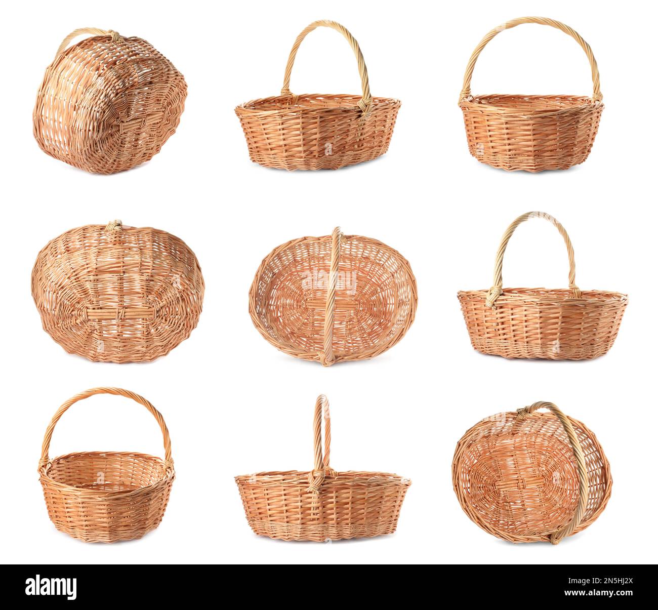 Set with empty wicker baskets on white background Stock Photo - Alamy