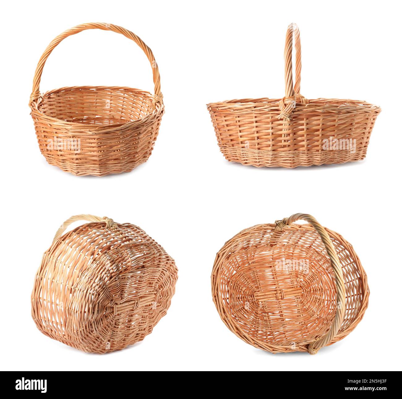 Set with empty wicker baskets on white background Stock Photo - Alamy