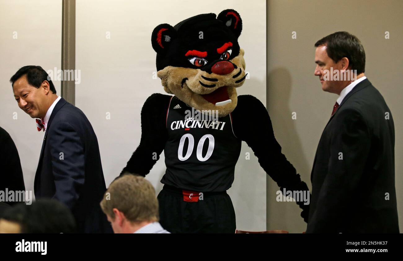 Mike Bohn, right, walks past the school mascot as he is introduced as ...