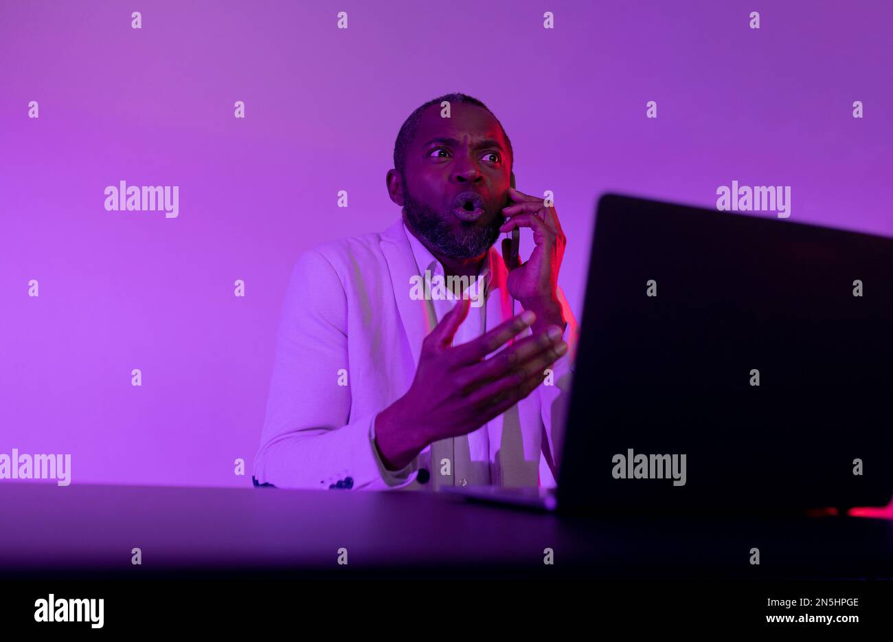 Angry african man laptop talking hi-res stock photography and images ...