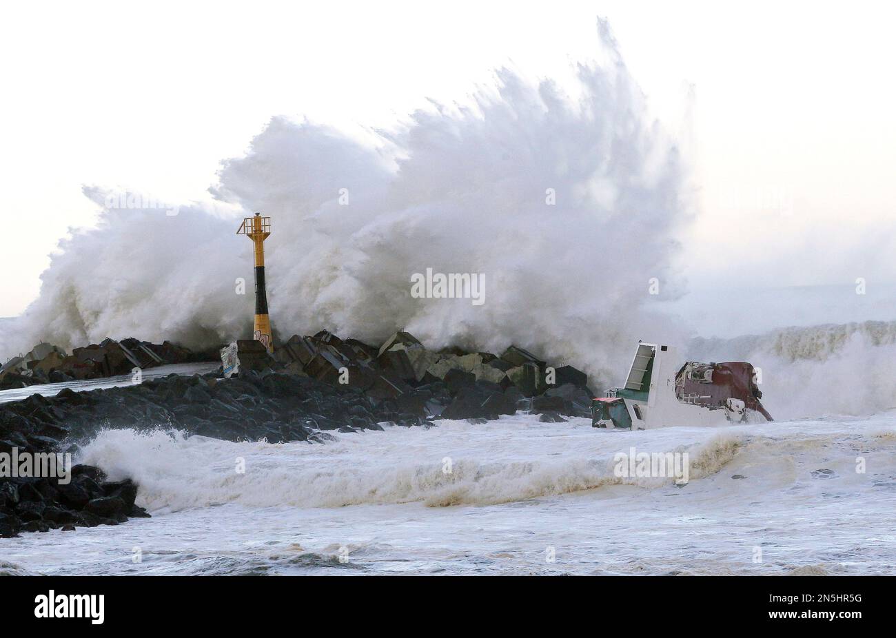 Waves knock against the wreckage of the Spanish cargo ship "Luno" that ...