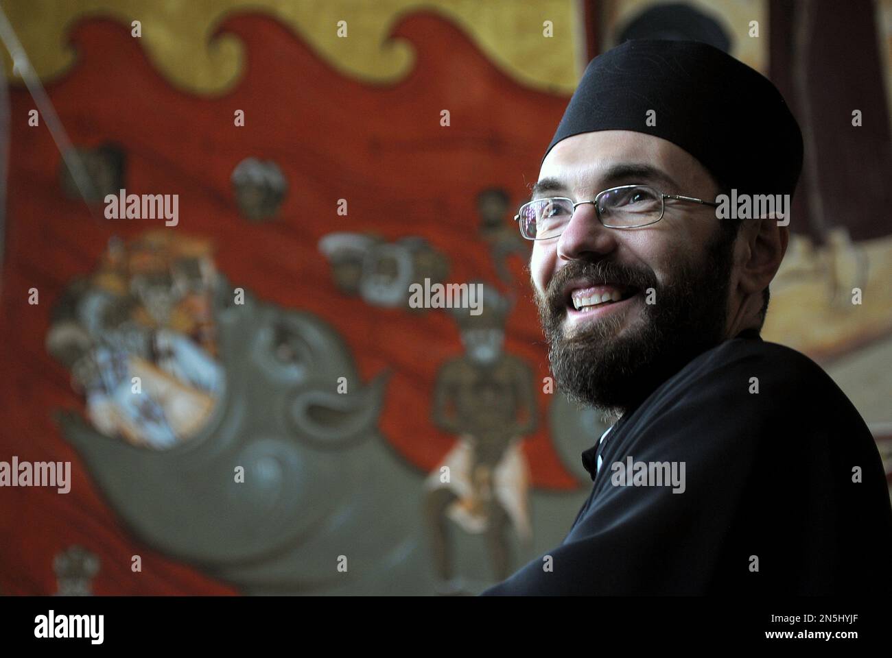 In this photo taken Tuesday, Feb. 4, 2014 Orthodox priest Branko ...