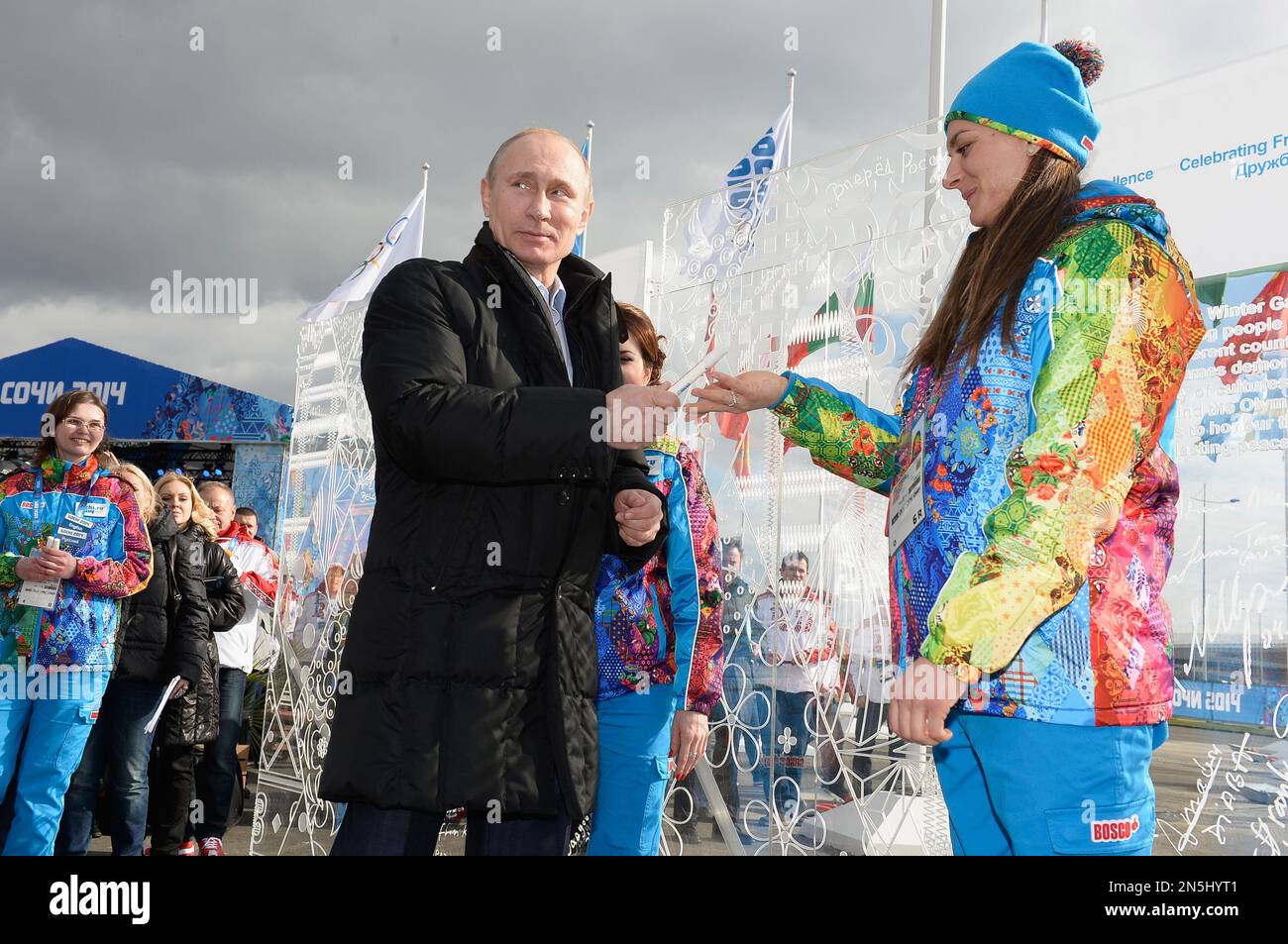 Russian President Vladimir Putin poses with Olympic Village Mayor Elena ...