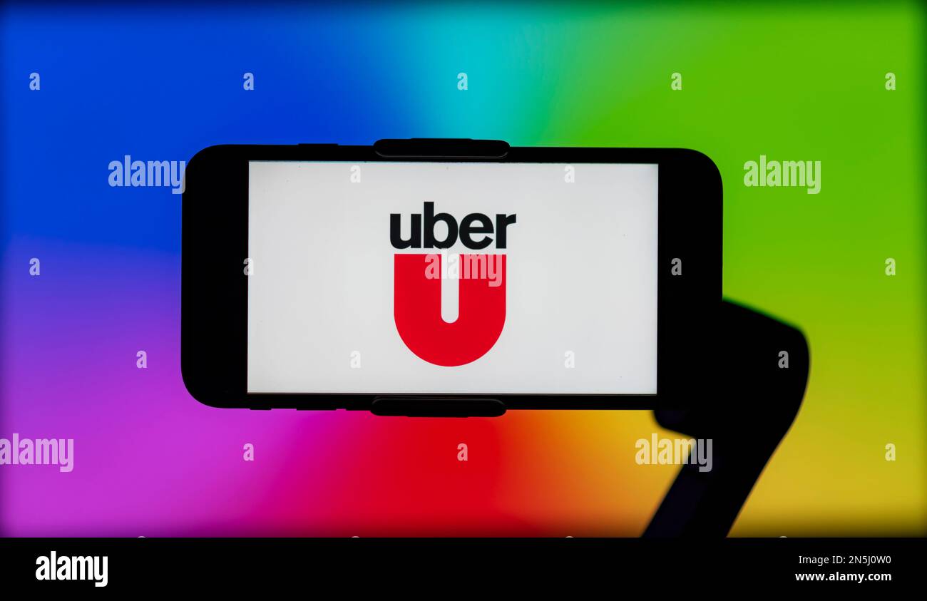 In this photo illustration, Uber logo is seen displayed on a mobile ...