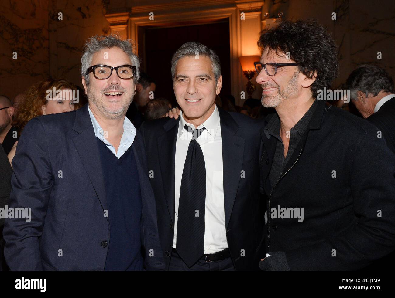 Directors Alfonso Cuarón, left, George Clooney and Joel Coen attend ...