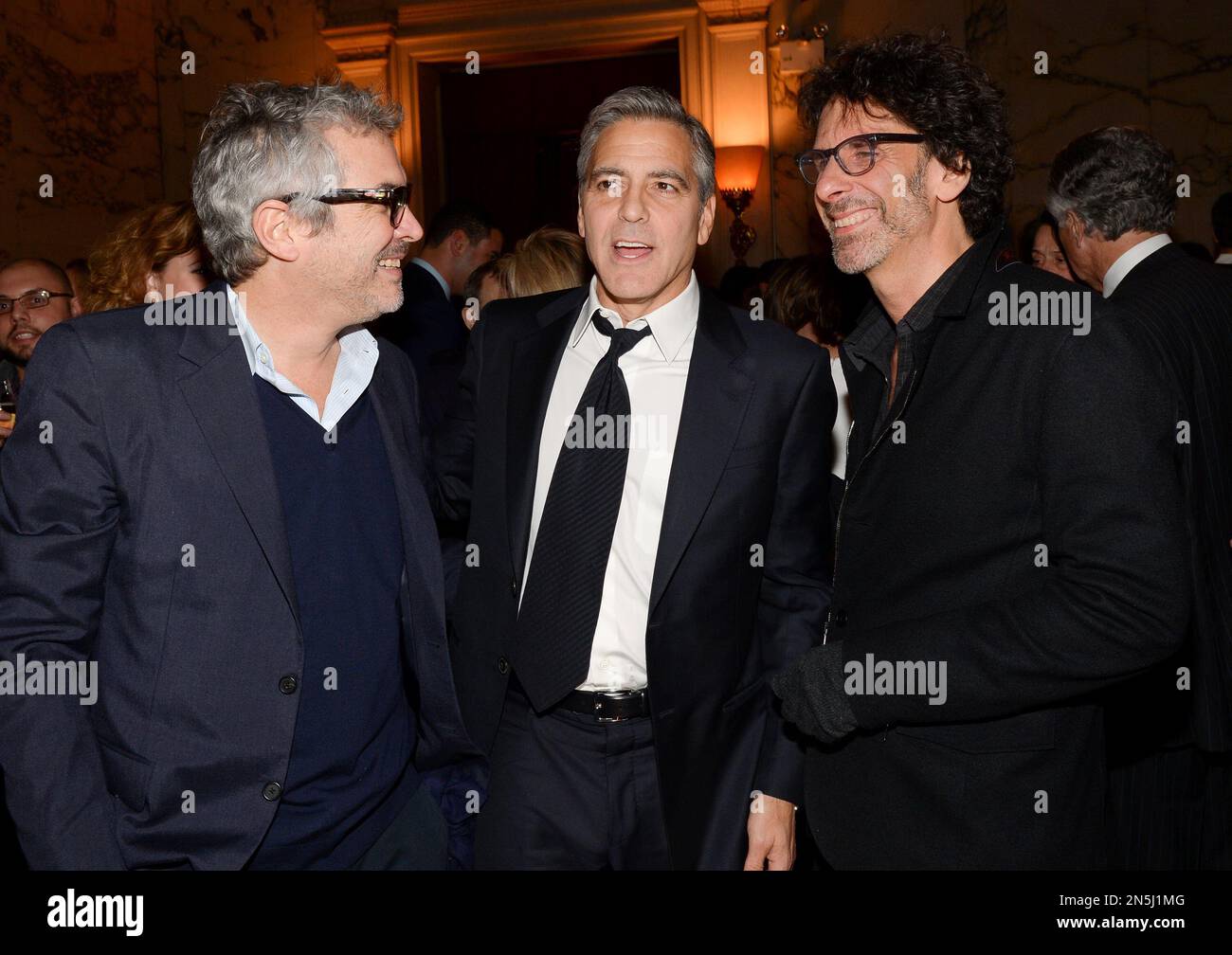 Directors Alfonso Cuarón, left, George Clooney and Joel Coen attend ...