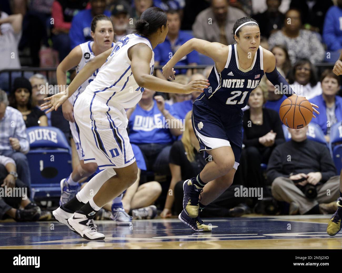 Notre Dame's Kayla McBride (21) dribbles as Duke's Richa Jackson ...