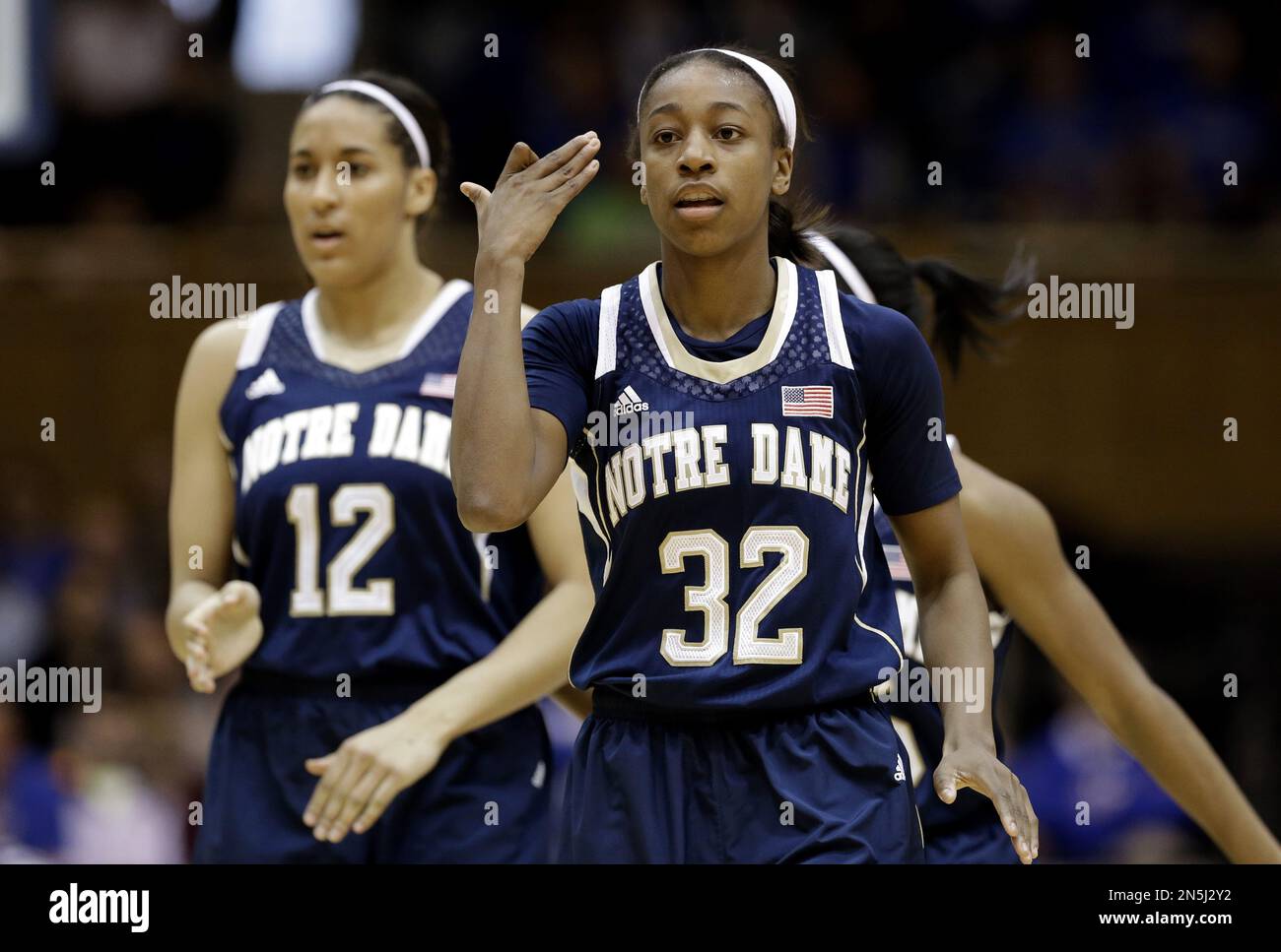 Notre Dame's Taya Reimer (12) and Jewell Loyd (32) react following Loyd ...