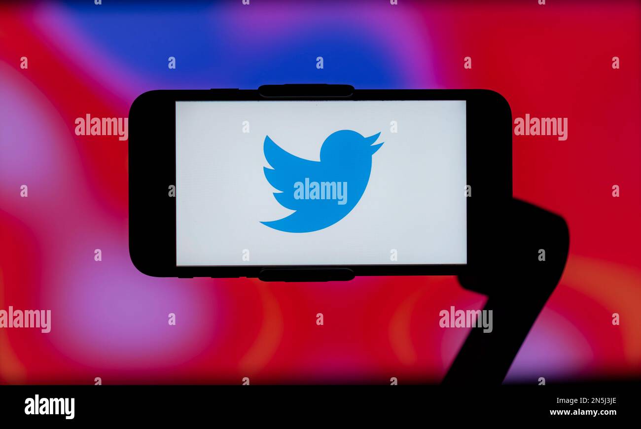 In this photo illustration, twitter logo is seen displayed on a mobile ...