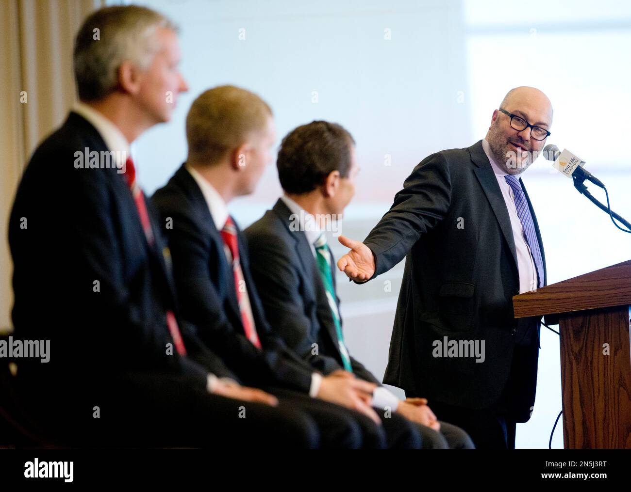 Charlie Stillitano, right, CEO of Relevent Sports, gestures towards ...