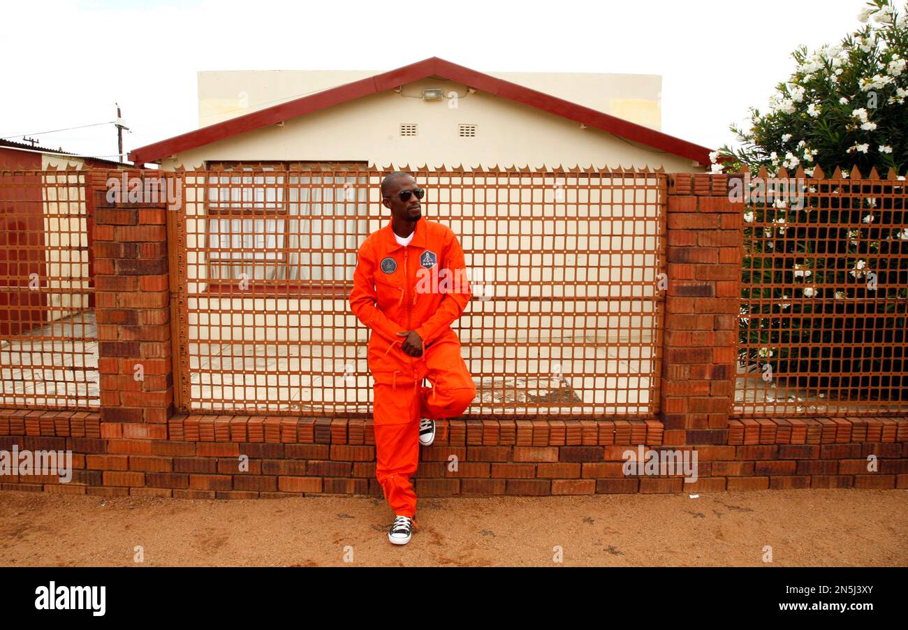 In this picture taken Monday, Feb. 3, 2014, Mandla Maseko, wearing a ...