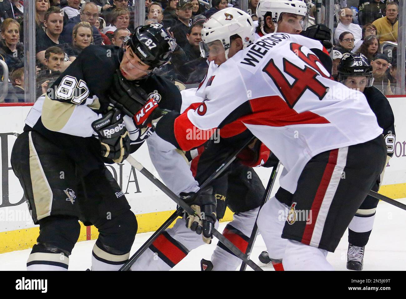 Ottawa Senators' Patrick Wiercioch (46) gets his glove in the face of ...