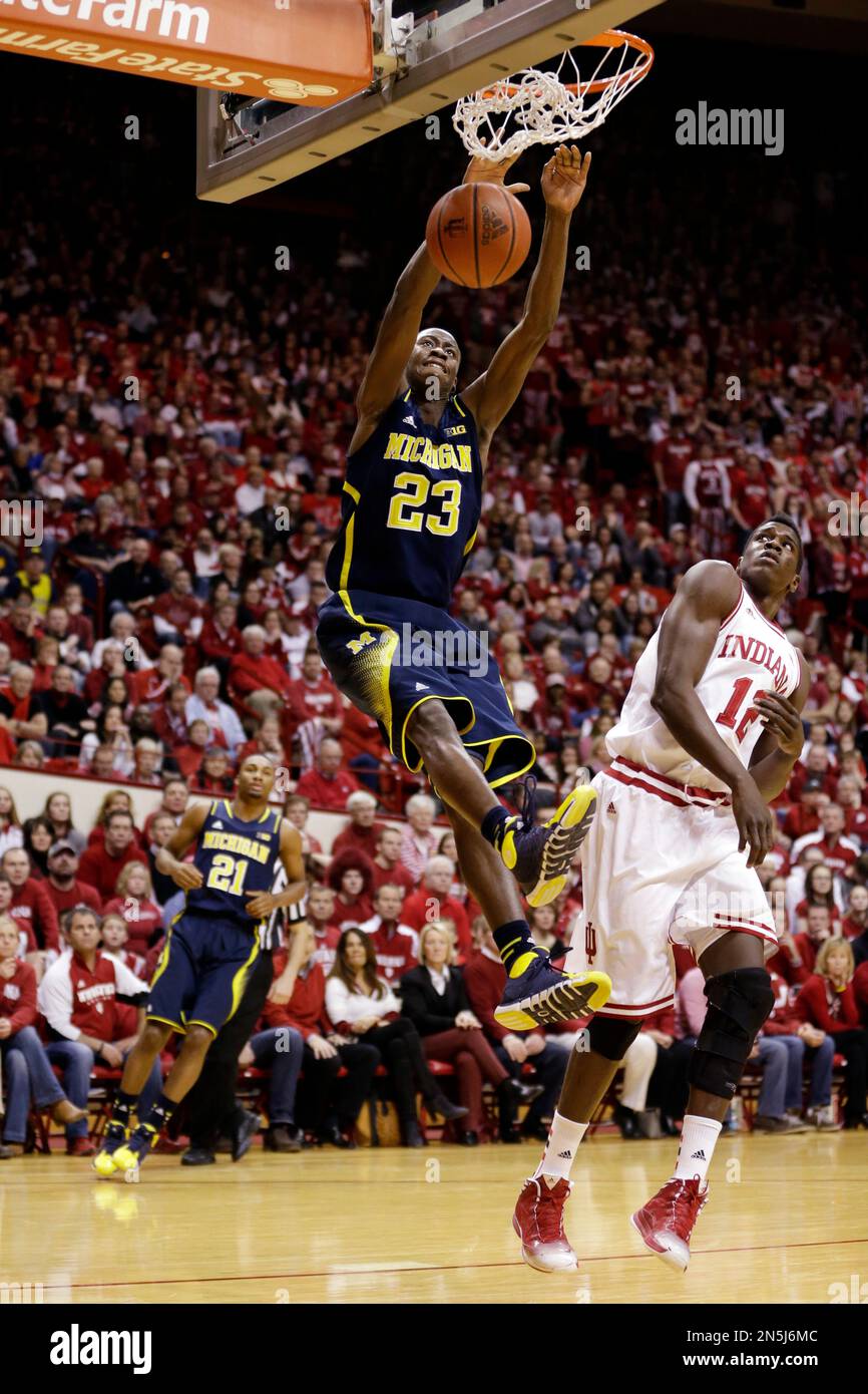 Michigan guard Caris LeVert (23) gets a dunk over Indiana forward ...