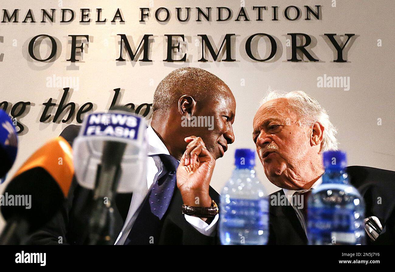 South Africa's deputy chief justice Dikgang Moseneke, left, chats with ...