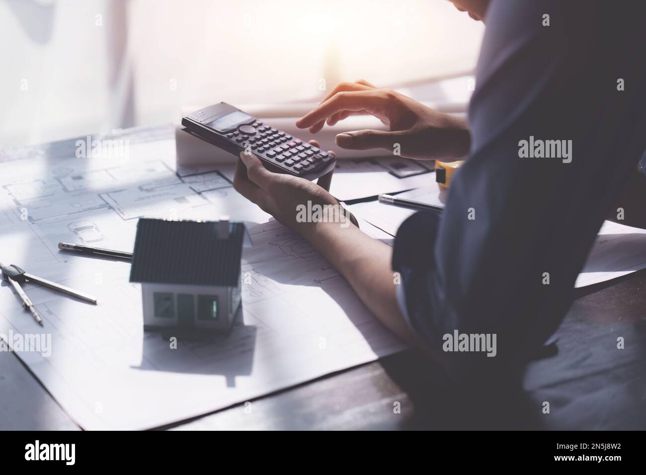 Architecture or Civil engineer analyze with construction blueprint ...