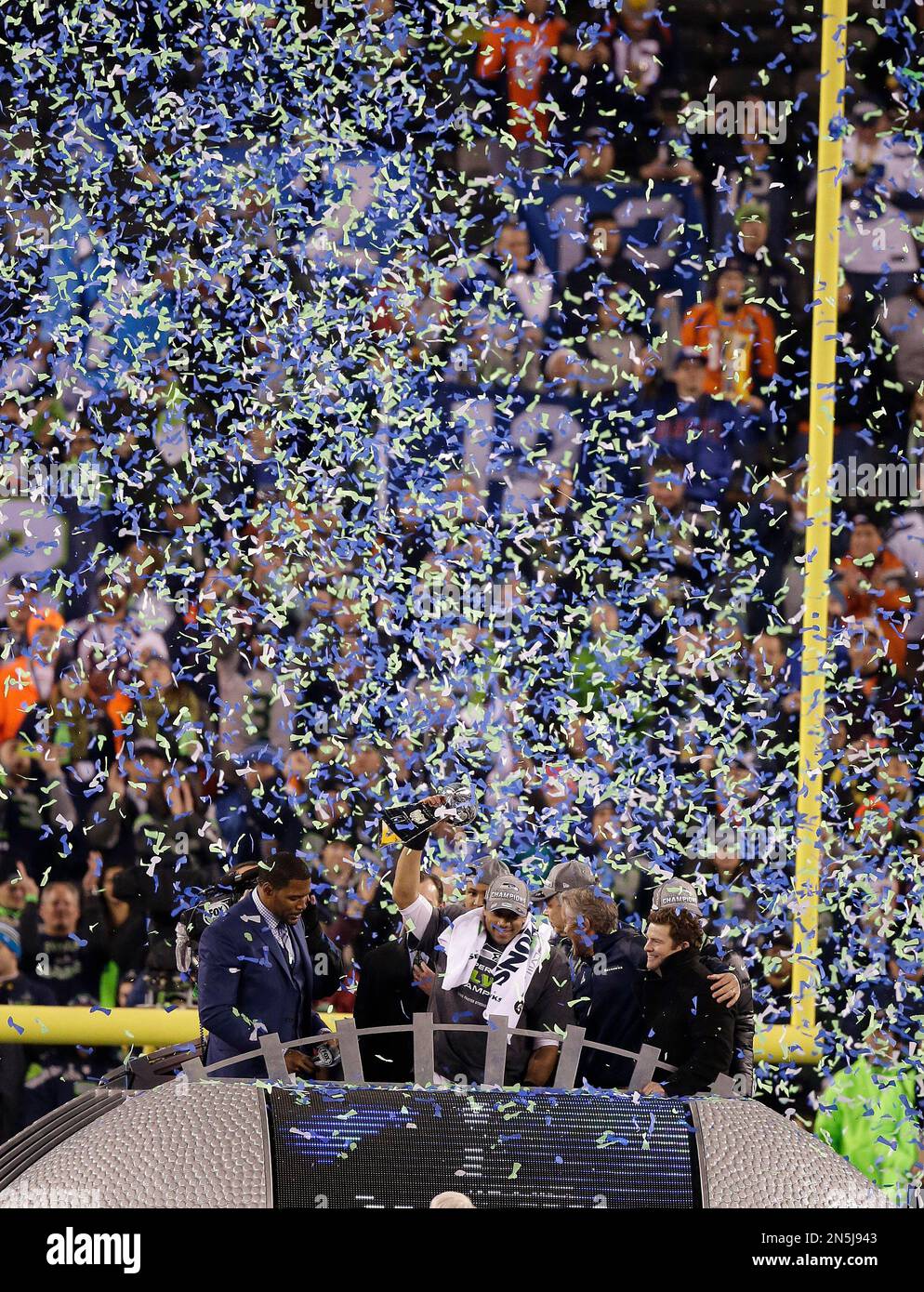 Seattle Seahawks' Russell Wilson, bottom center, celebrates after the ...