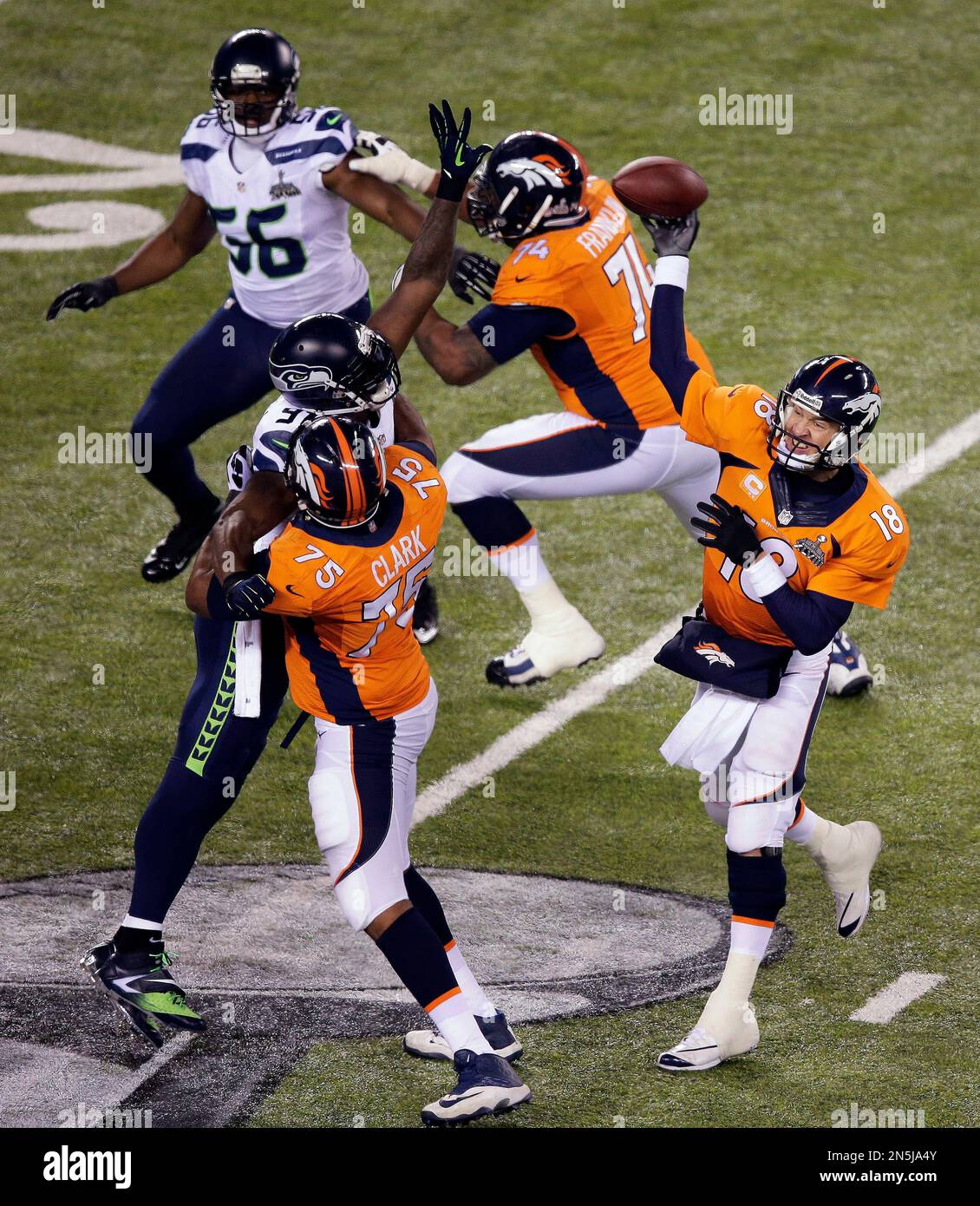 Denver Broncos' Peyton Manning (18) throws against against the Seattle ...