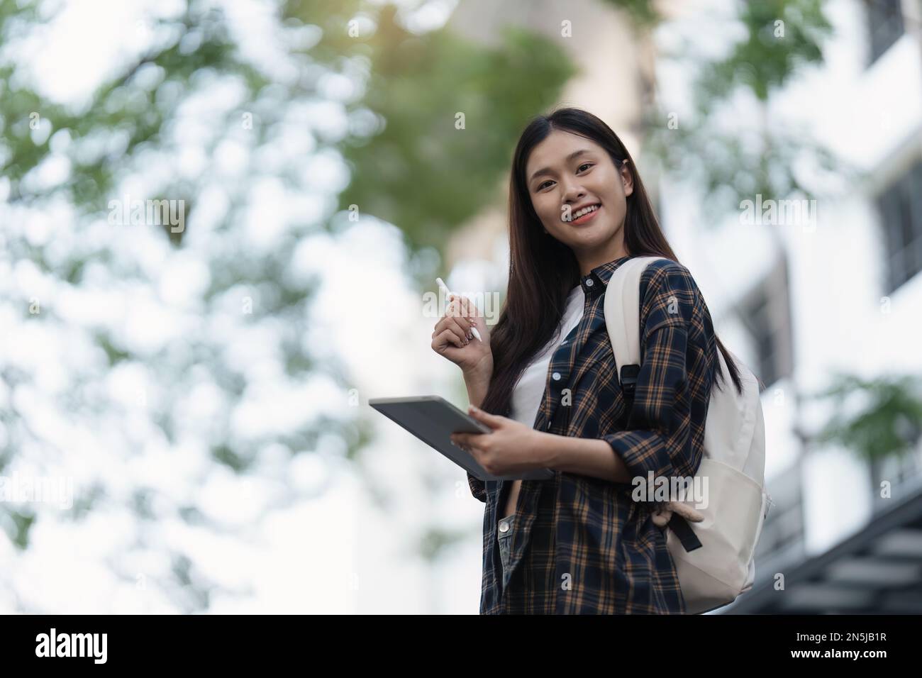 Portrait of beautiful student woman in university ready for learning ...