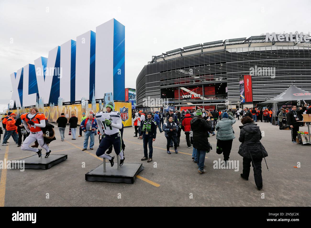 Fans pose for photographs as they arrive at MetLife Stadium before the ...