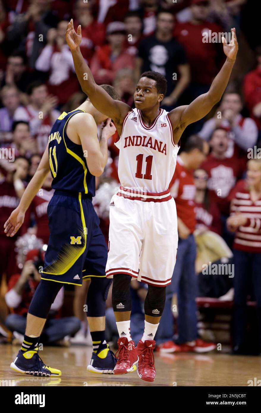 Indiana guard Yogi Ferrell (11) celebrates as Michigan calls a timeout ...