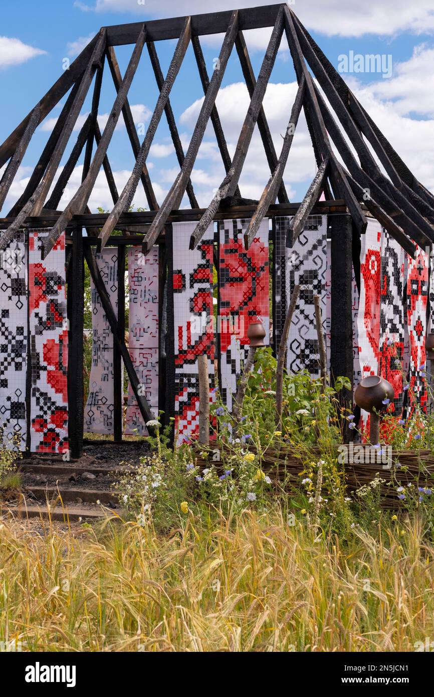 The skeleton of a burned Ukrainian cottage in the What Does Not Burn ...