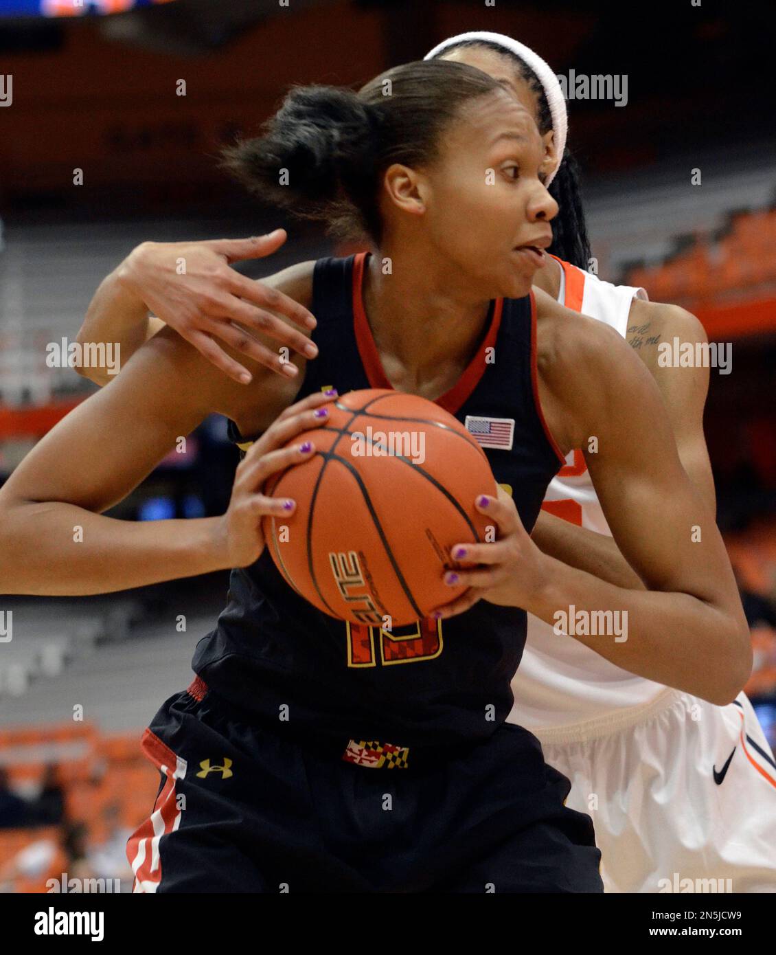 Maryland's Alicia Devaughn looks to pass as Syracuse's Briana Day ...