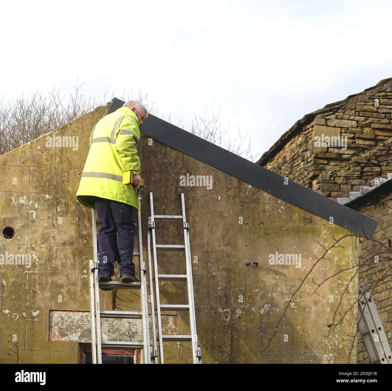 Working up a ladder hi-res stock photography and images - Alamy