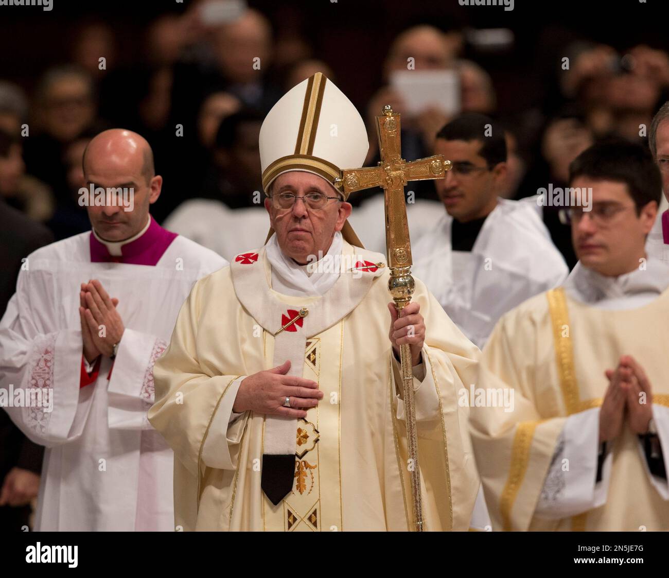 Pope Francis holds the pastoral staff as he leaves after celebrating a ...