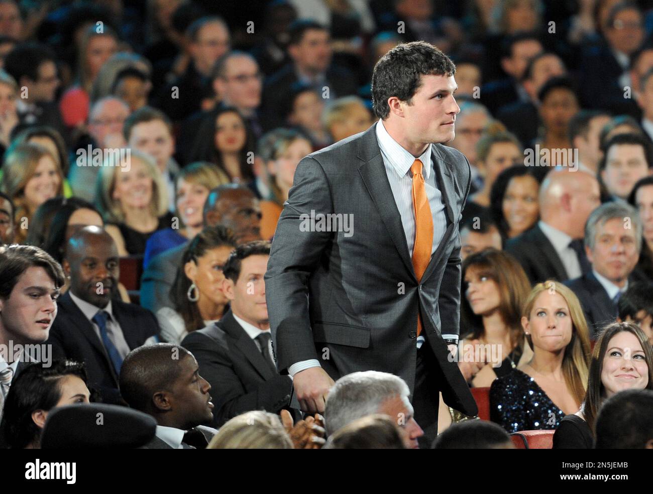 Luke Kuechly walks on stage to accept the AP Defensive Player of the ...