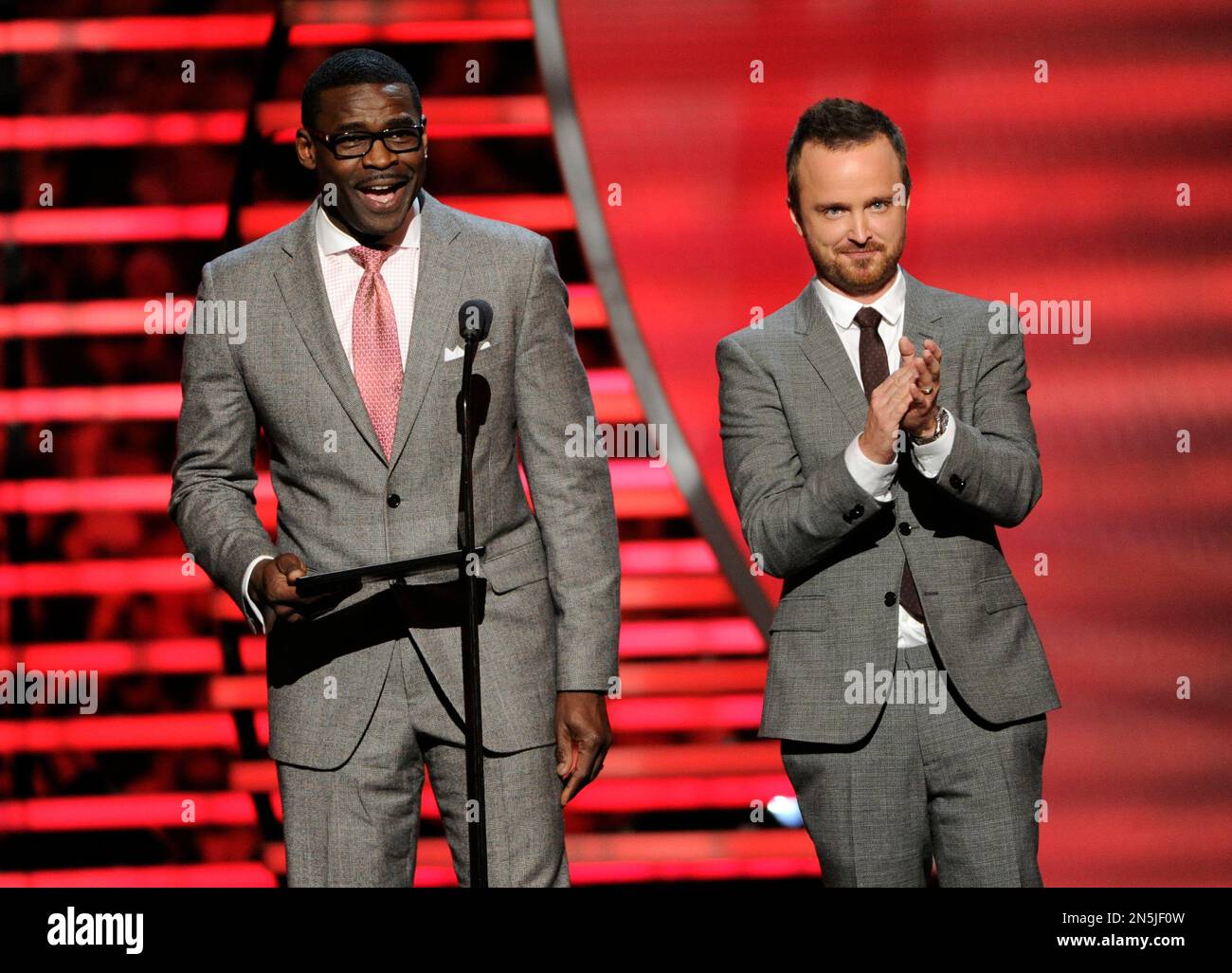 Former NFL player Michael Irvin, left, and actor Aaron Paul speak on ...