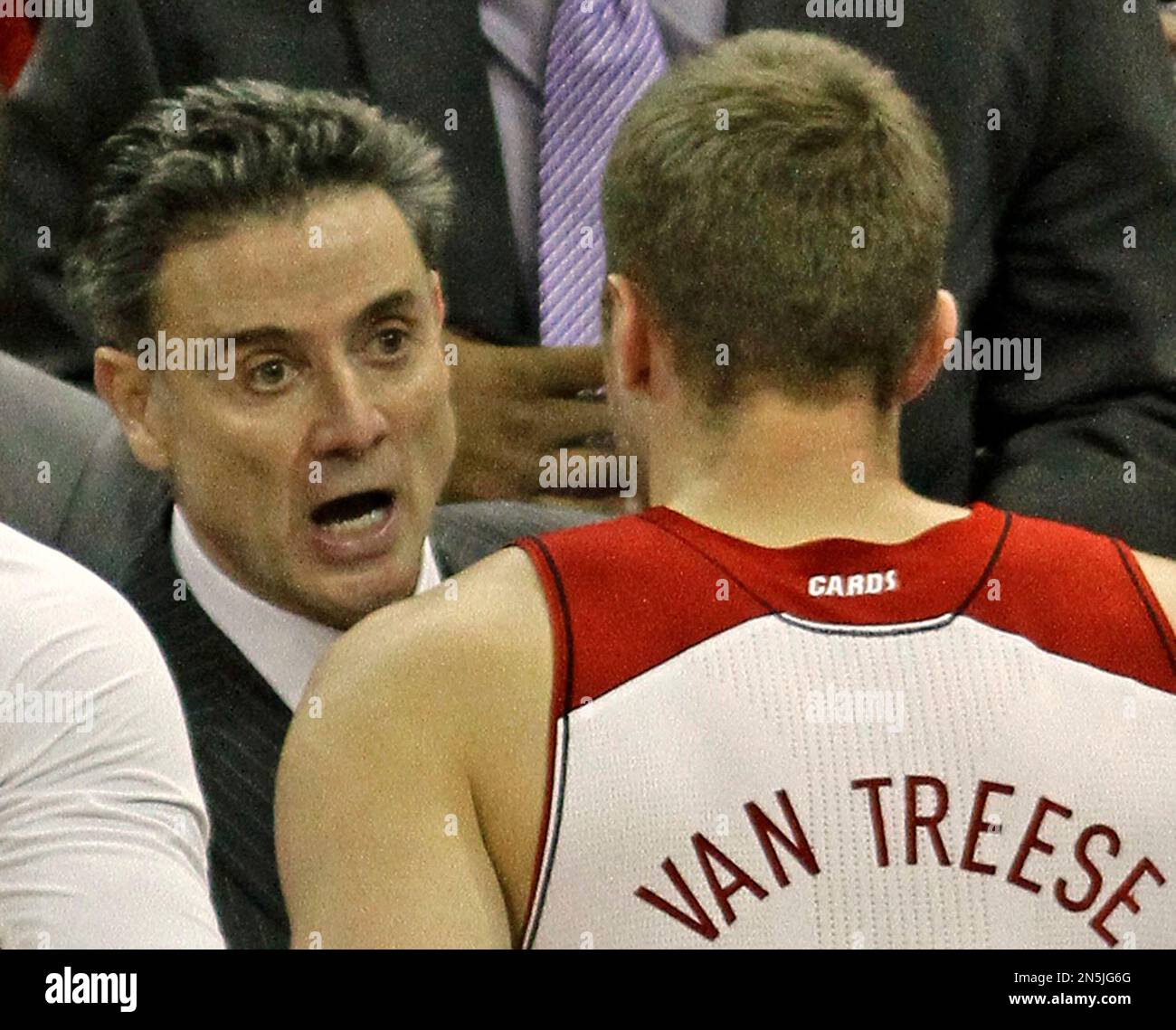 Louisville coach Rick Pitino, center, talks to forward Stephen Van ...