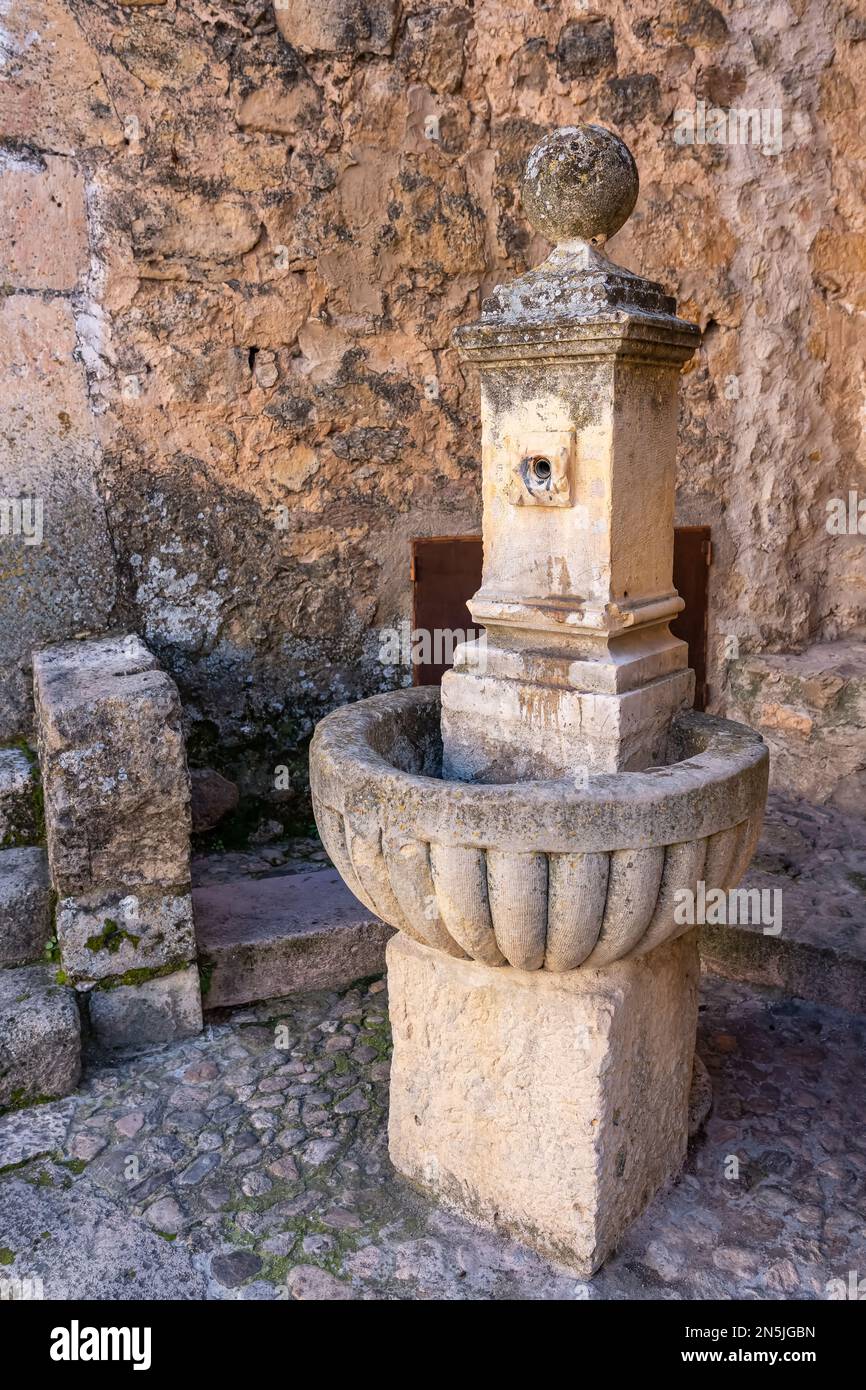 Old stone fountain to give water to passers-by in the street of the ...
