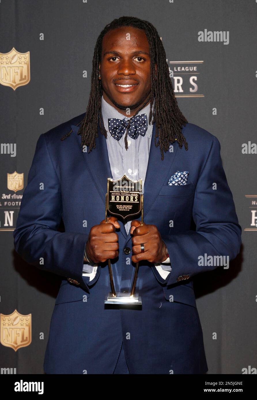 Jamaal Charles of the Kansas City Chiefs poses backstage with his award ...