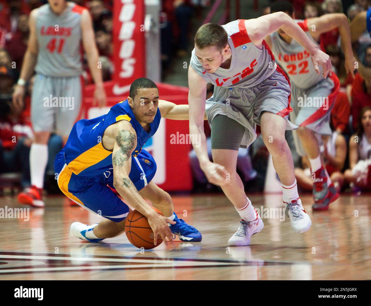 San Jose State's Jalen James, left, hits the floor to recover a loose ...