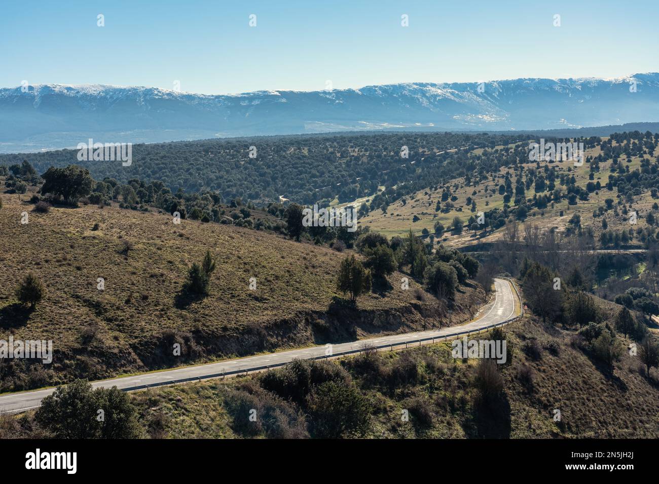 Mountain landscape with paved road heading into the mountains in the ...