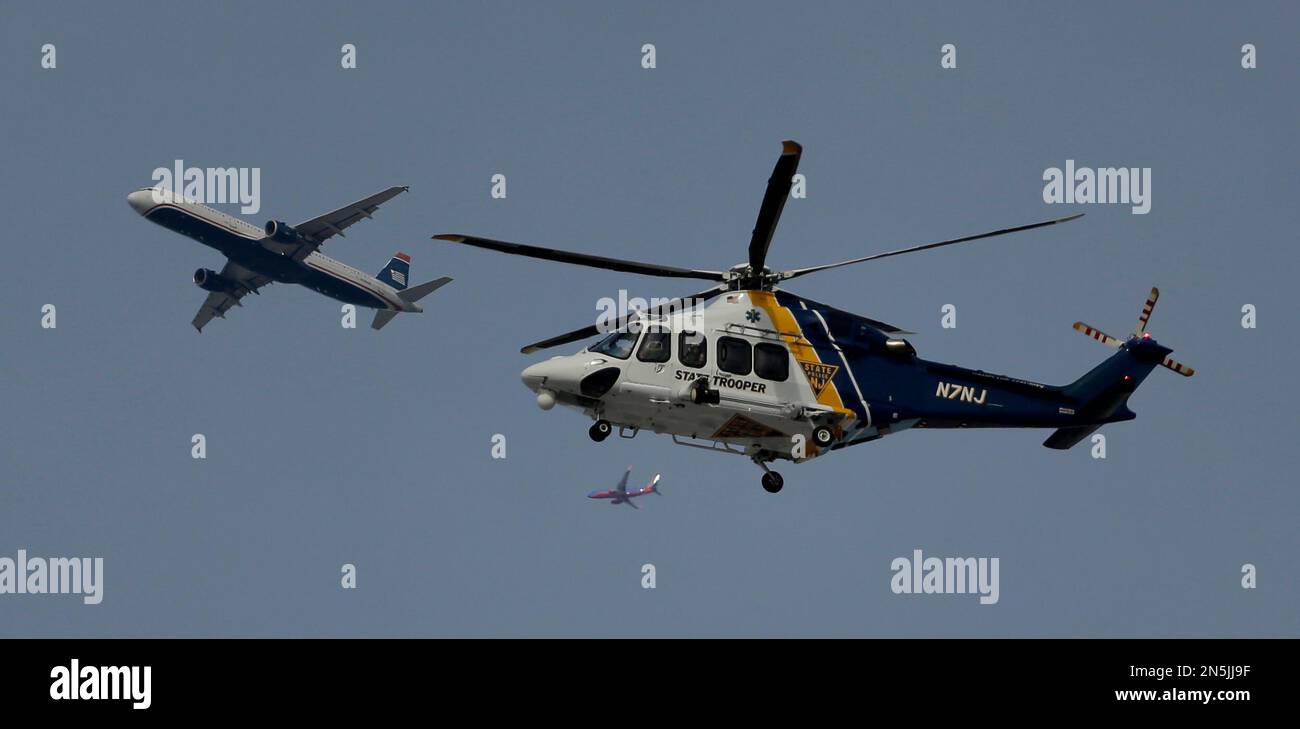 A New Jersey state police helicopter patrols the sky above MetLife ...