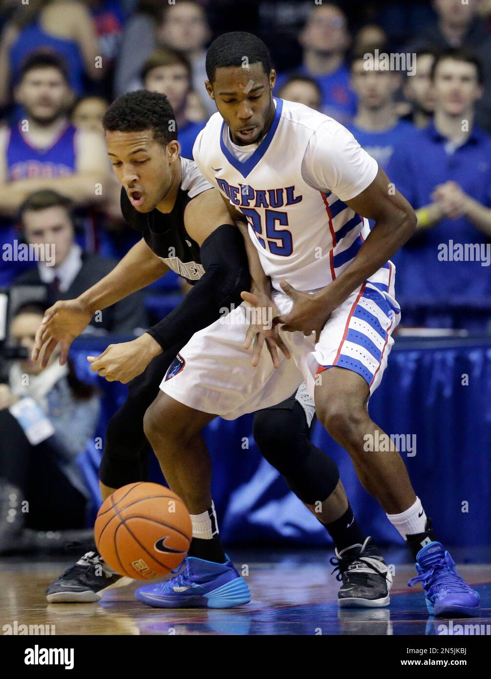 Providence guard Josh Fortune, left, and DePaul guard Durrell McDonald ...
