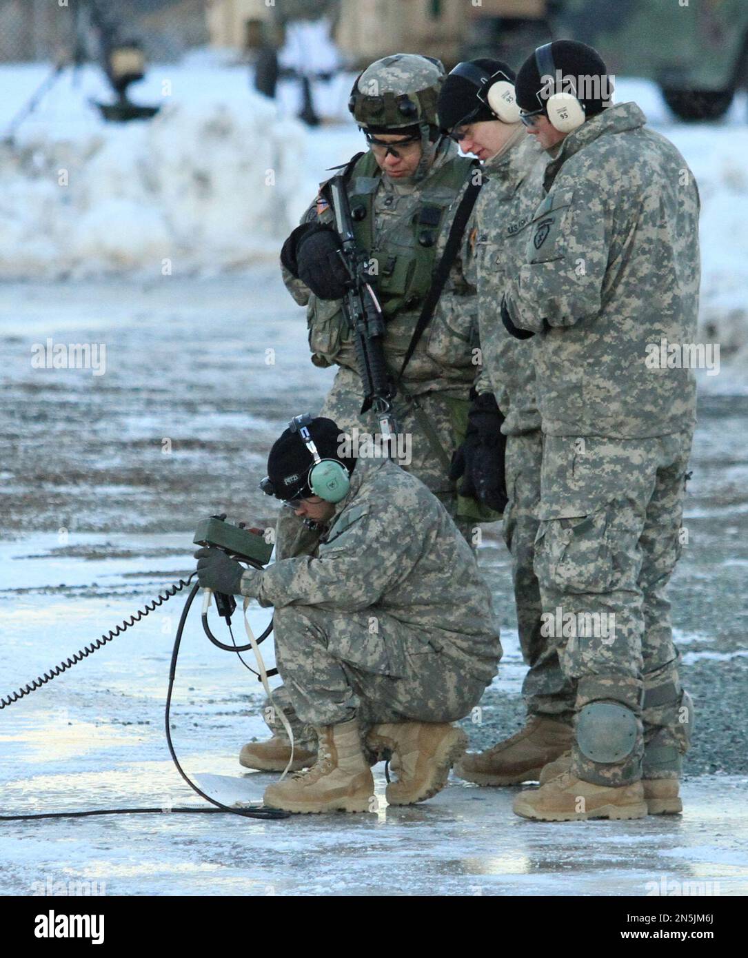 In this Jan. 30, 2014 photo, Specialist Josue Montonez, crouching ...