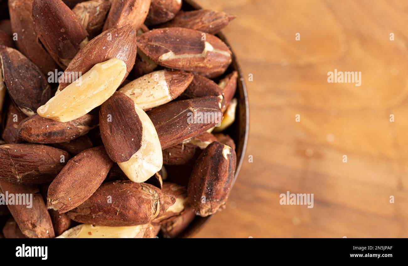 A Bowl of Pili Nuts from the Philippines on a Wooden Table Stock Photo ...