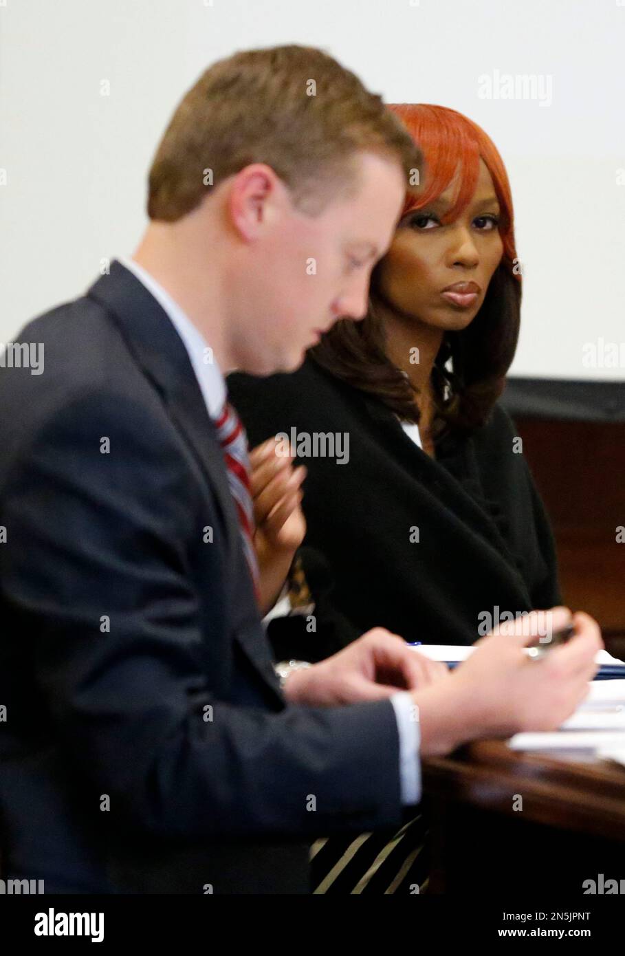 Natasha Stewart, also known as Pebbelz Da Model, looks toward reporters ...