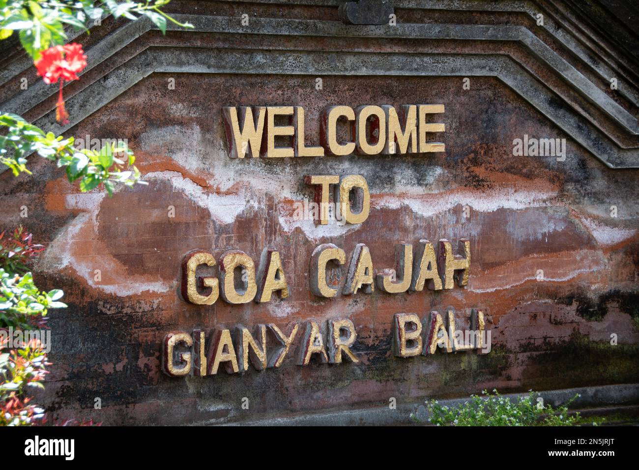 The welcome sign to the elephant cave "Goa Gajah" on the Indonesian ...