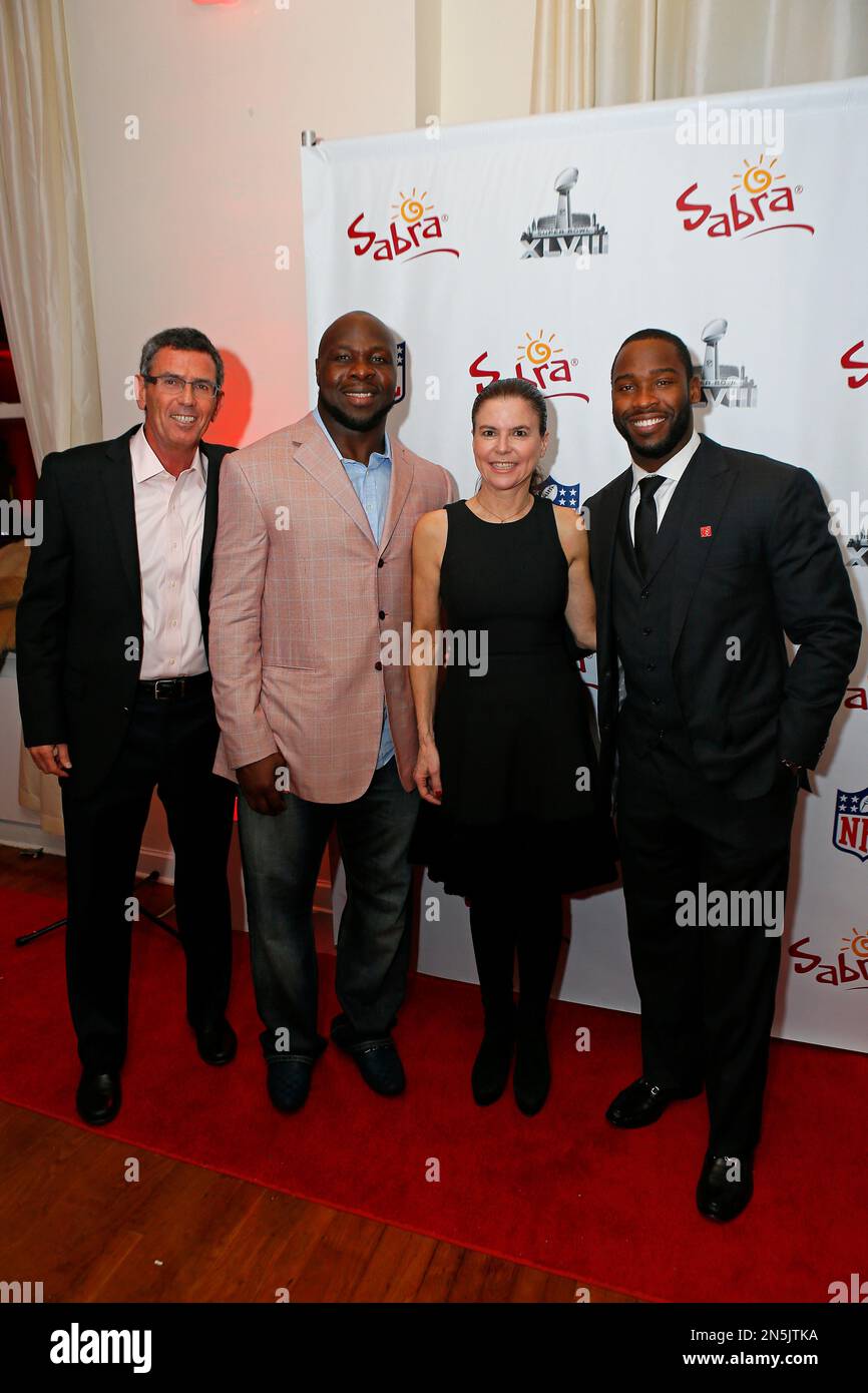 Ronen Zohar CEO of Sabra, left, Tamba Hali of the Kansas City Chiefs ...