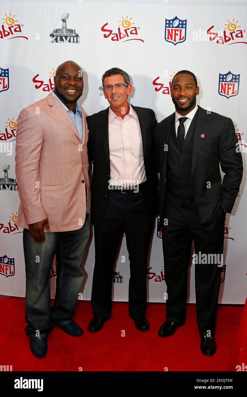 Ronen Zohar CEO of Sabra, center, Tamba Hali of the Kansas City Chiefs ...