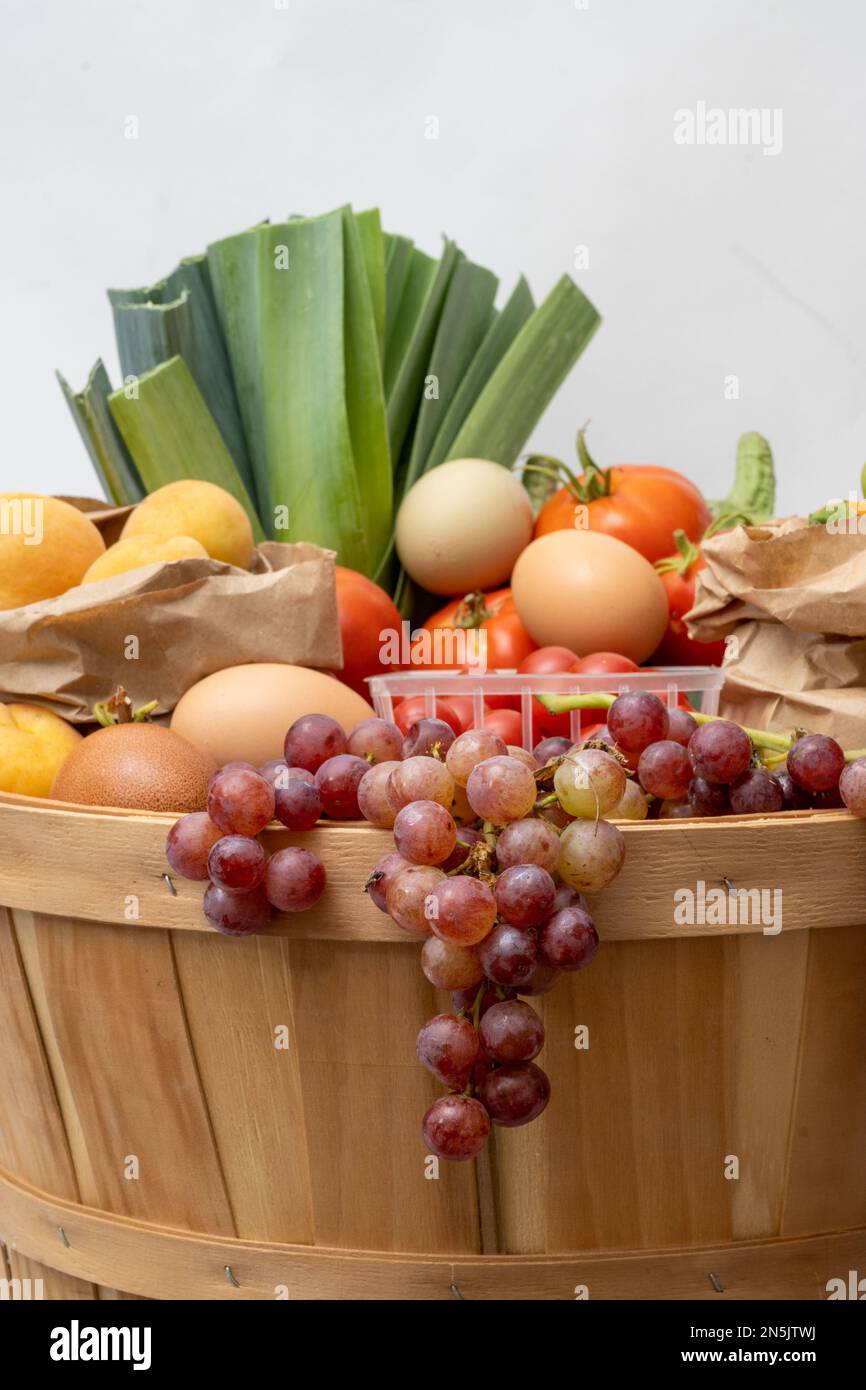 Organic vegetables bamboo basket full of fresh vegetables, fruit and ...