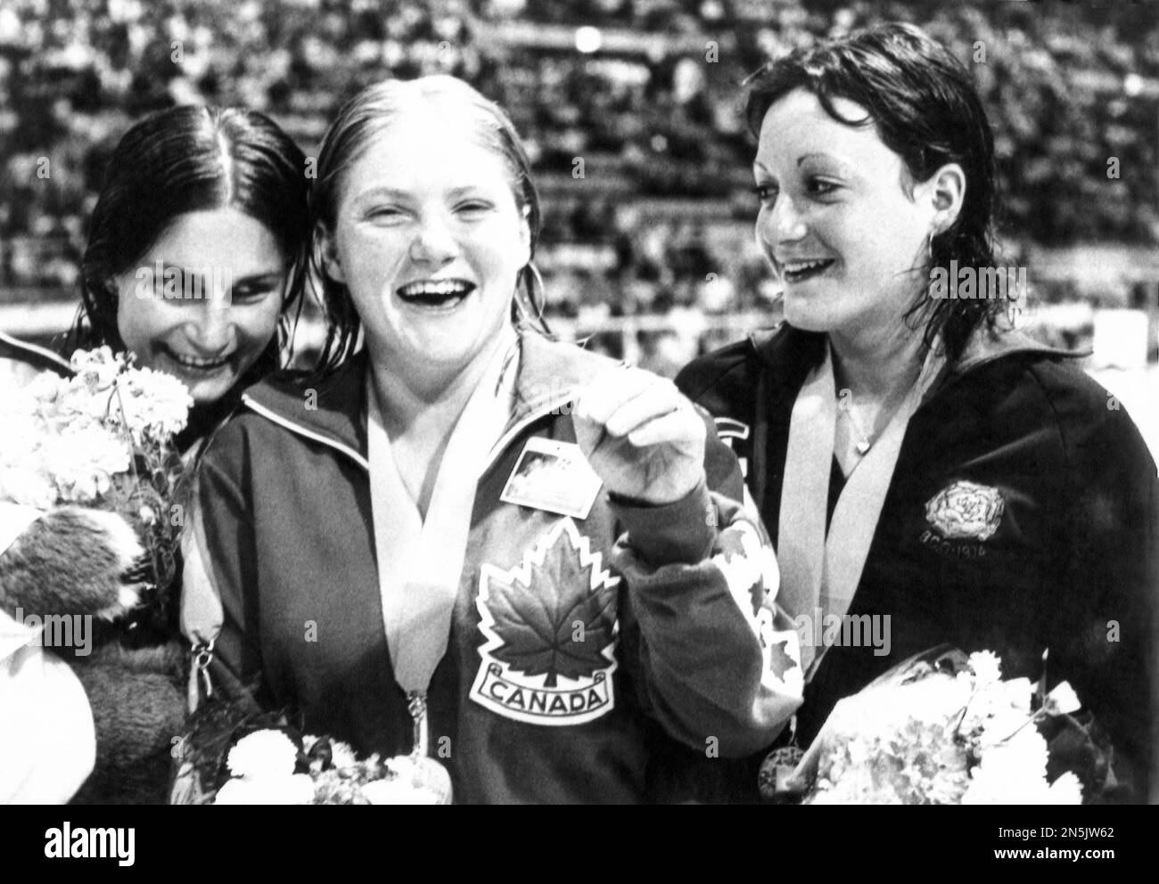 Beverly Boys of Canada, center, celebrates after winning the Gold medal ...