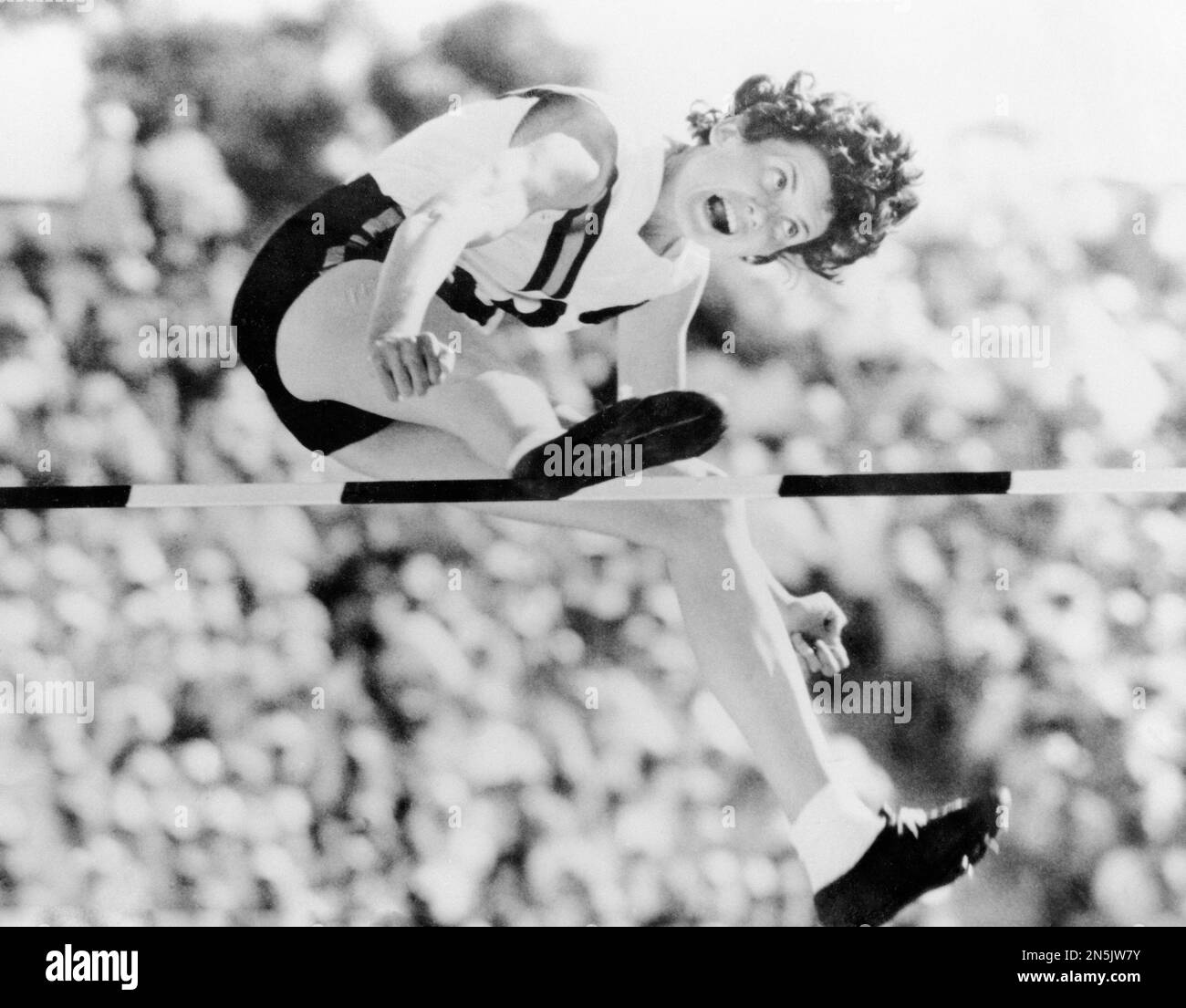 Robyn Woodhouse of Australia clears the bar at 5 feet 10 inches to win ...