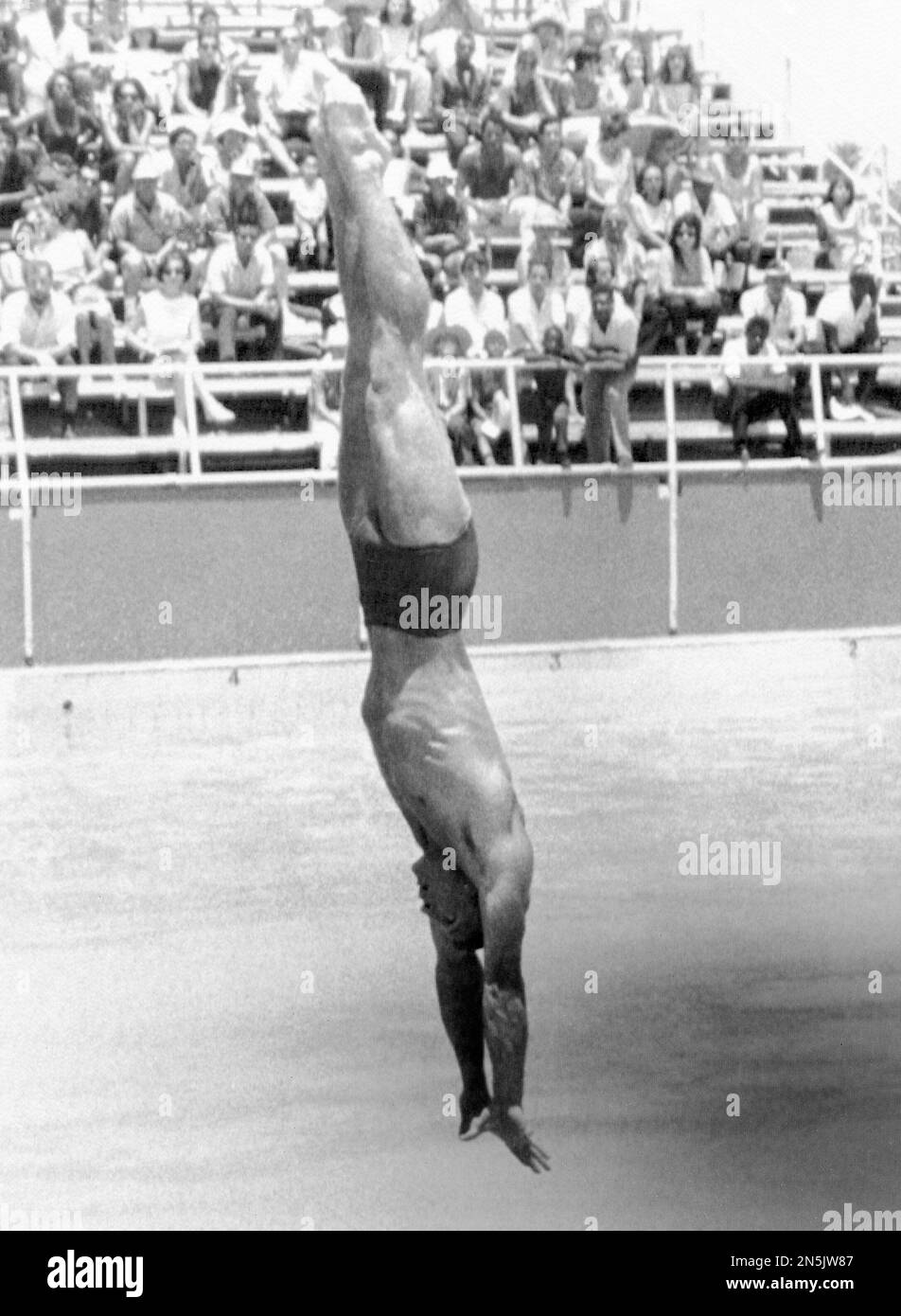 Brian Phelps of England completes his dive in the Springboard event at ...